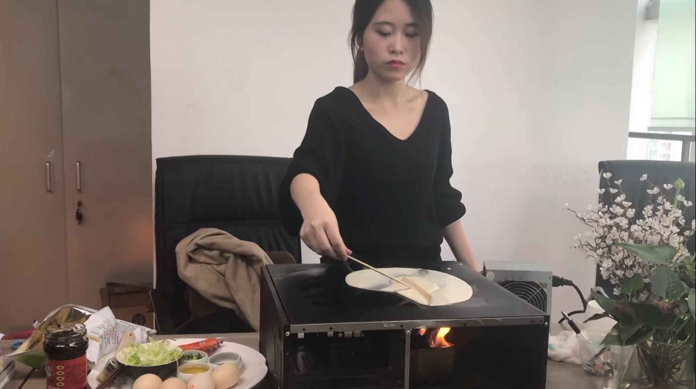 This Chinese YouTuber Is Going Viral For Cooking Food Using Only Office ...